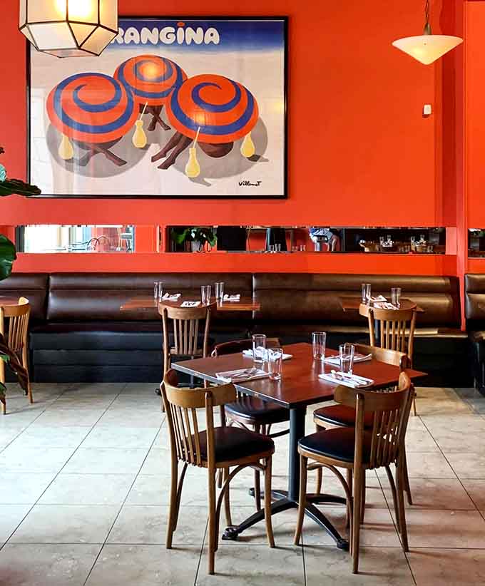 Vintage Italian advertising posters add authentic charm to a dining room that celebrates food and culture beautifully.