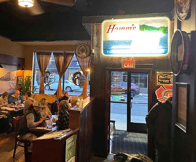 That vintage Hamm's sign glowing like a beacon, welcoming you home to comfort and creativity combined.