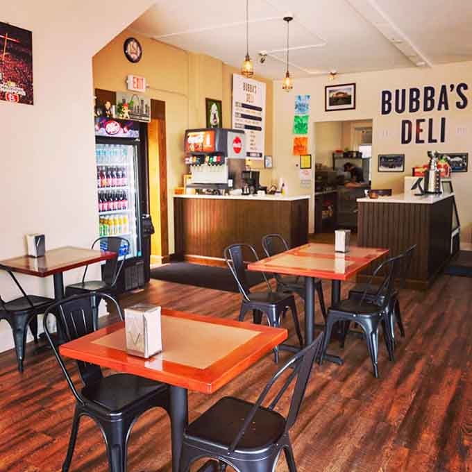 The dining room radiates that perfect neighborhood deli charm where great sandwiches and good conversations happen daily.