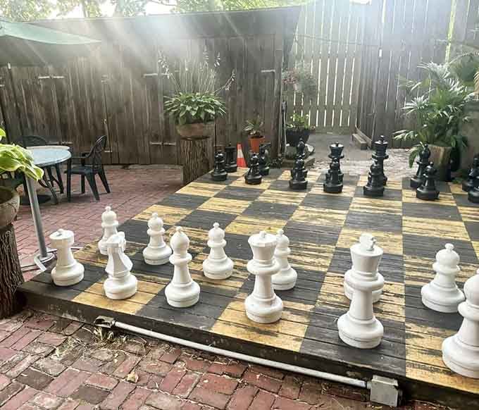 Life-size chess in a garden courtyard, because sometimes the best move is taking time to actually play.