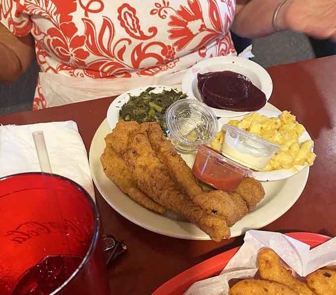 Fried catfish strips with greens and mac and cheese prove that seafood belongs in the comfort food conversation.