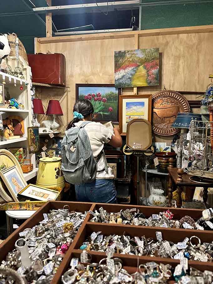 A shopper deep in treasure-hunting mode, surrounded by possibilities and probably reconsidering how much trunk space they have.