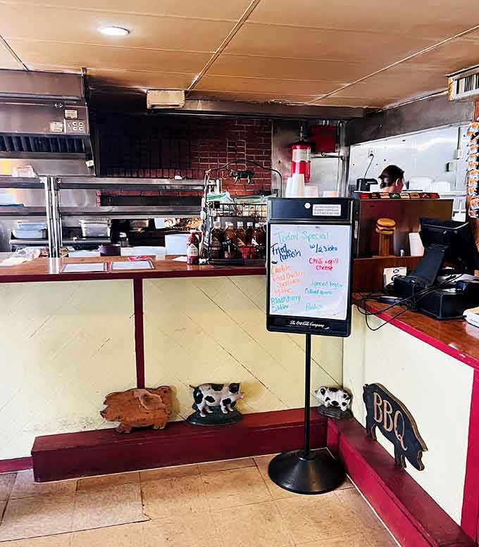 Pig decorations and daily specials on the board show a restaurant that takes barbecue seriously, not itself.