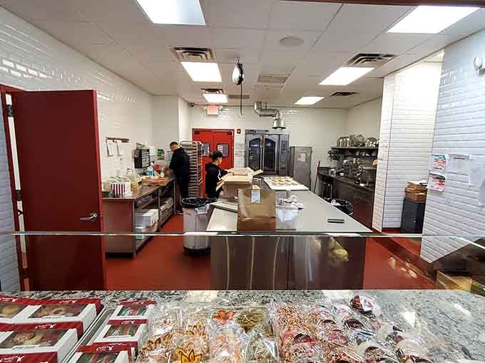 Behind the scenes where the magic happens, bakers working with the focus of surgeons and the creativity of artists.