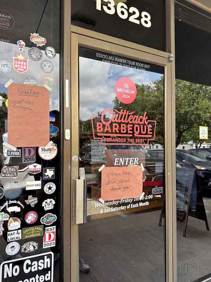 The entrance proudly displays stickers and awards, like a barbecue hall of fame you're about to walk through.