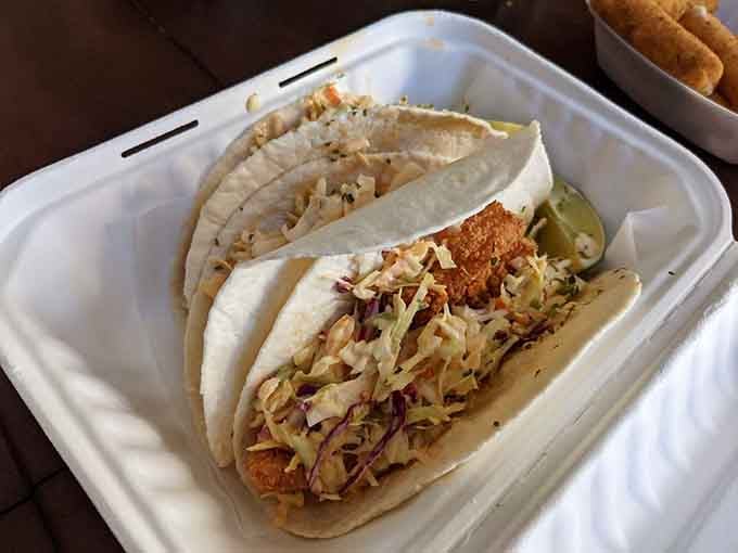 Fish tacos that understand the assignment: fresh seafood, proper toppings, and tortillas that actually hold together.