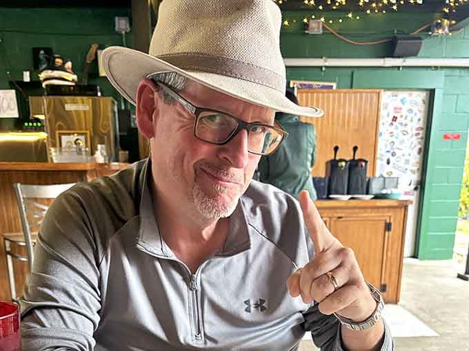 That satisfied smile of someone who just discovered what a real cheeseburger is supposed to taste like, life forever changed.
