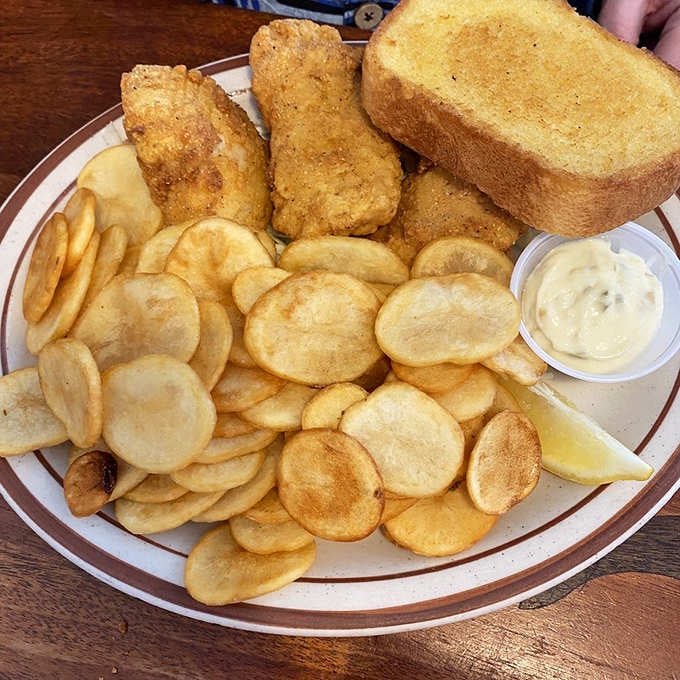 Fish and chips piled high enough to feed a small army or one very determined seafood lover.