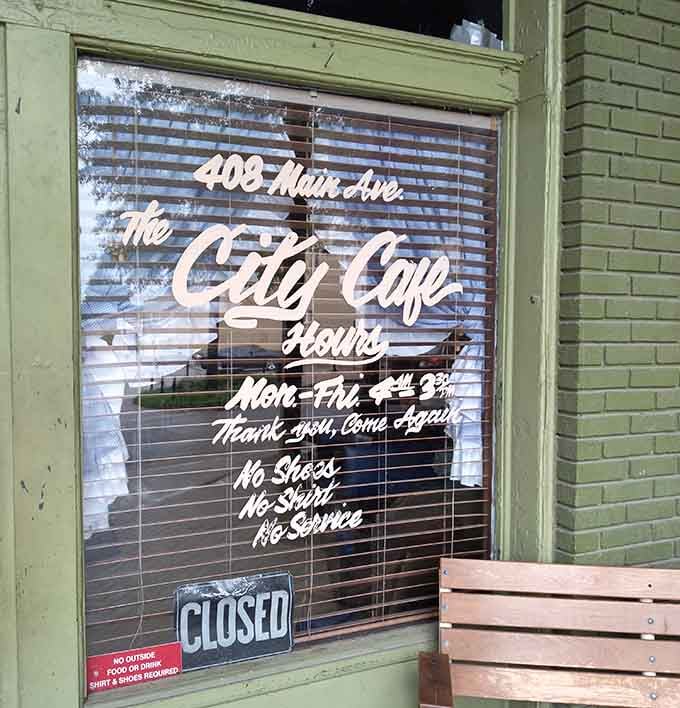 Those hours painted on the window tell you everything: Monday through Friday, no shortcuts, no compromises, just honest food.