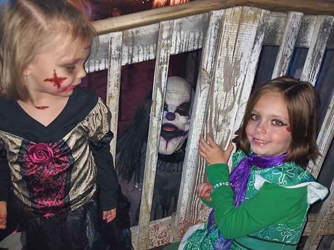 These young visitors get the lights-on tour experience, proving Creepyworld understands not everyone's ready for full-contact psychological warfare yet.