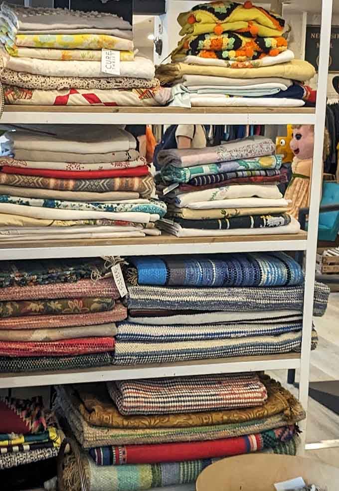 Blankets and textiles stacked with museum-quality precision, making your linen closet jealous from here.