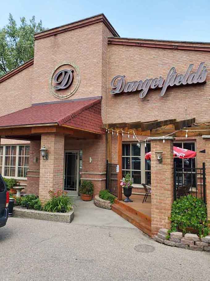 Flower boxes and welcoming signage mark the entrance to your next favorite dining destination in Shakopee.