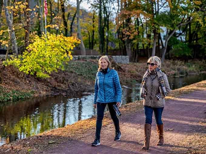 Two friends strolling the towpath have clearly discovered that the best therapy sessions happen outdoors, preferably near water.