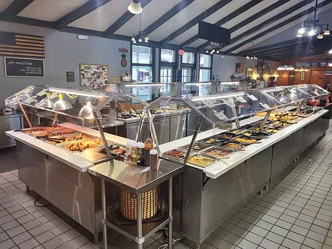 The buffet stations gleam under the lights, promising fresh food and endless possibilities for your hungry stomach.