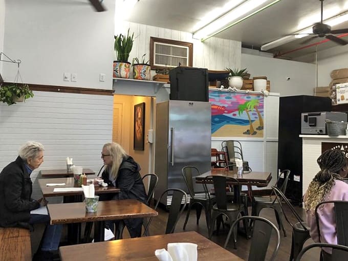 Diners enjoying their meals in the bright, airy space prove that great food brings people together across all backgrounds and ages.