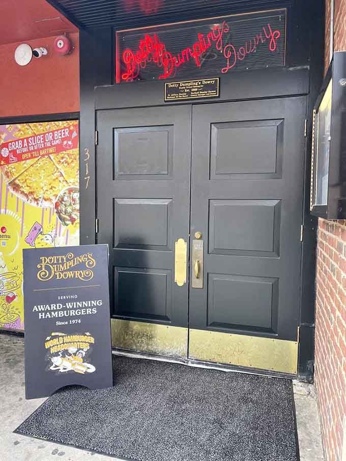 That neon script above the door isn't just a sign &ndash; it's a beacon calling burger pilgrims home.
