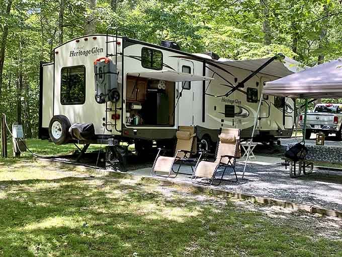 RV campers settle into shaded sites that prove roughing it doesn't mean sacrificing all creature comforts.