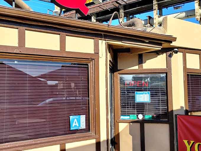 The entrance beckons with promises of smoky goodness and the kind of meal you'll remember forever.