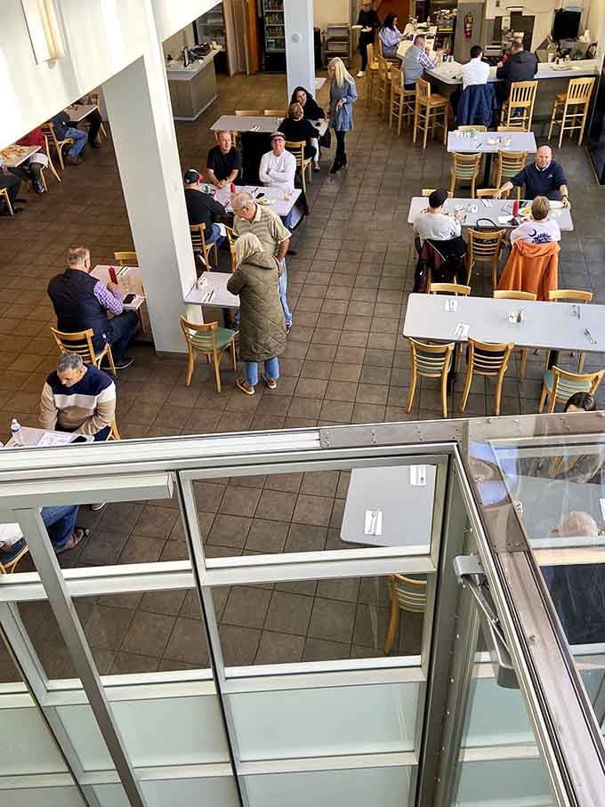A bird's eye view of satisfied diners enjoying their meals in this welcoming, unpretentious space.