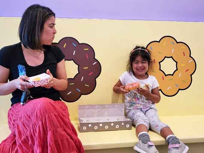 Sharing donuts across generations: proof that mochi donuts transcend age barriers and create universal joy and smiles.