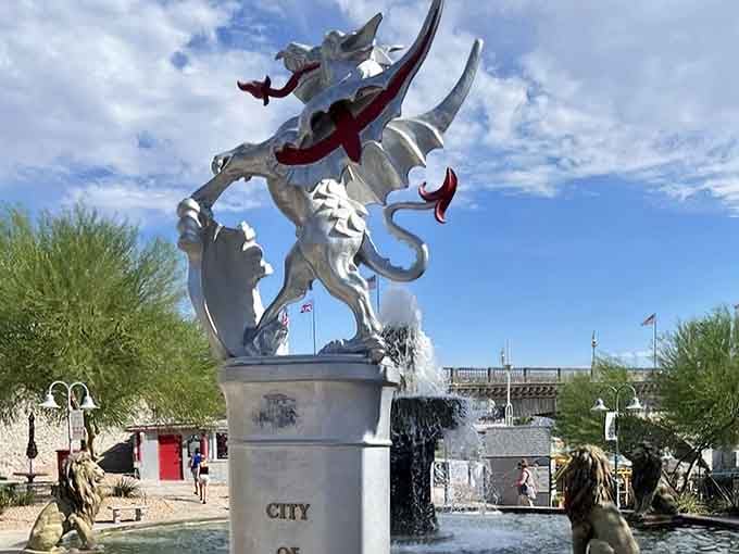 A fierce dragon sculpture guards the fountain, adding medieval flair to this already eclectic architectural celebration.