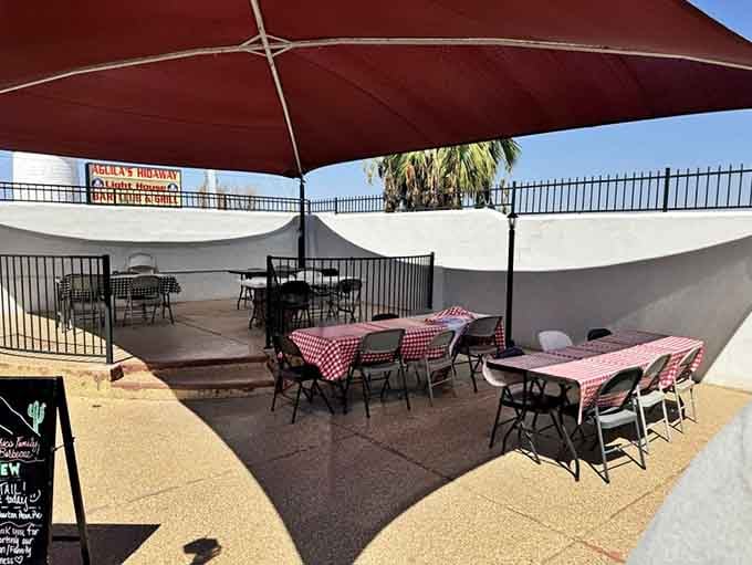 Outdoor seating with umbrellas means you can enjoy your brisket without melting into a puddle of Arizona sunshine regret.
