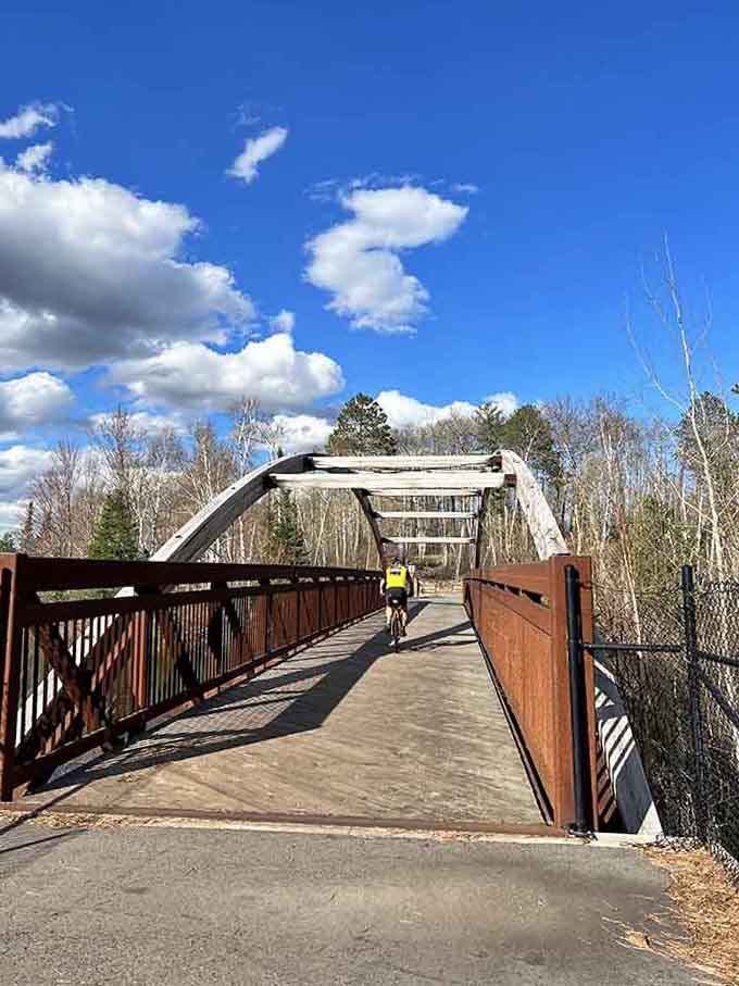Bike trails cross charming bridges that connect communities, making every ride feel like an adventure.