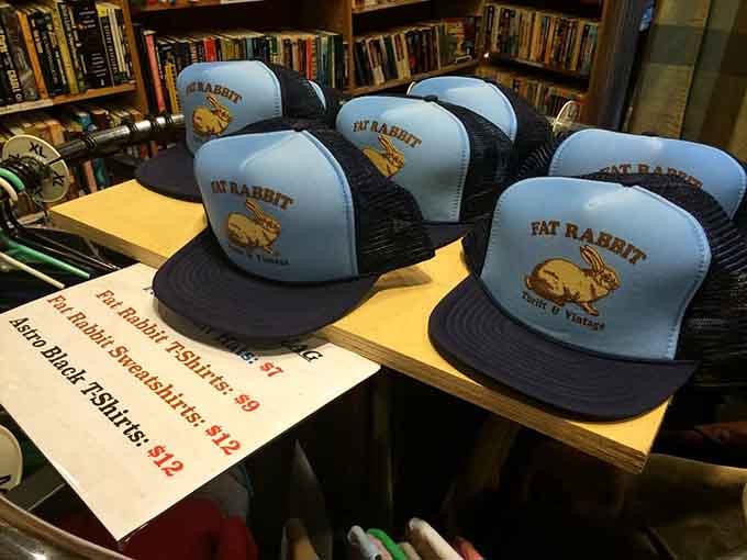Fat Rabbit branded trucker hats lined up like soldiers, ready to protect your head while advertising your excellent taste in thrift stores.