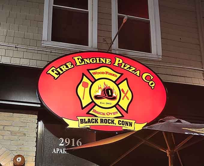 The Fire Engine Pizza Co. sign announces itself proudly, because confidence looks good on a restaurant.