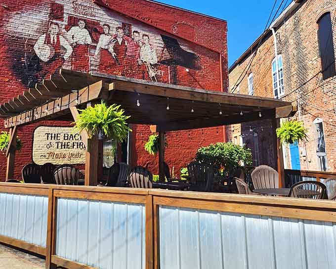 The outdoor patio with that firefighter mural provides the perfect spot for enjoying barbecue under Indiana skies.