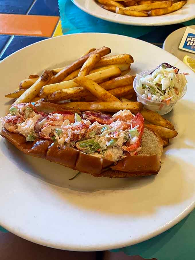 Buttery lobster roll overflowing with meat, making New England jealous one delicious bite at a time.