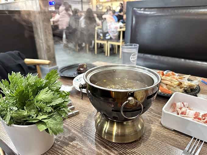 Hot pot at your table means interactive dining where you're the chef, minus the culinary school debt.