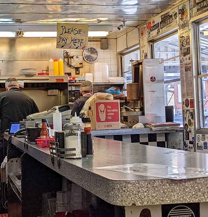 Behind that counter, skilled hands work the griddle like artists, turning simple ingredients into breakfast masterpieces daily.