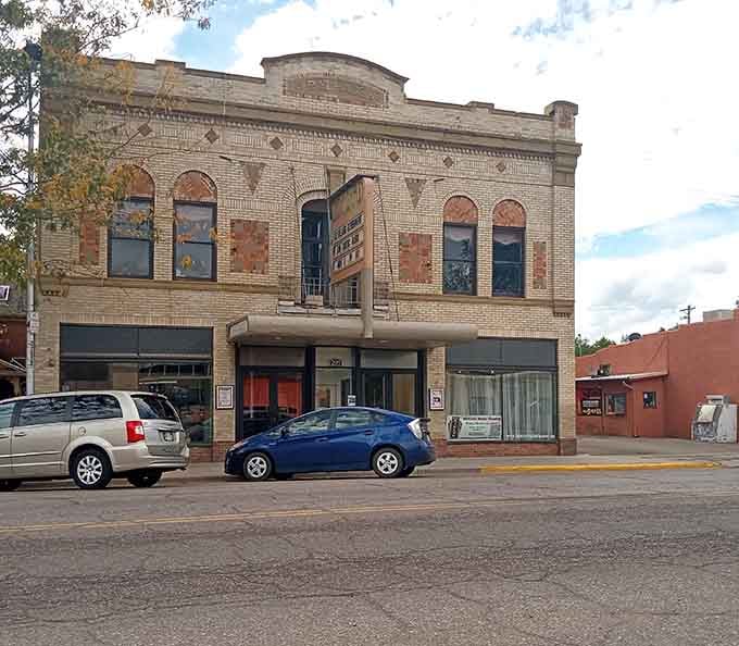 The Rialto Theater's weathered facade tells stories of countless movie nights when entertainment meant leaving your house and talking to neighbors.