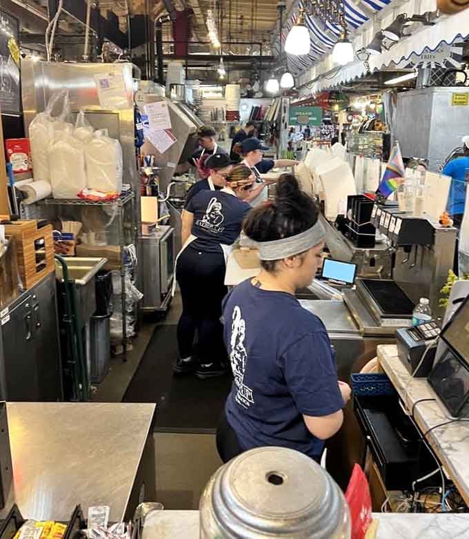 The team works with focused efficiency, turning orders into golden happiness faster than you can say extra cheese curds.