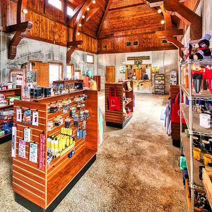 The gift shop interior proves that even souvenir shopping can happen in beautiful spaces with exposed beam ceilings.