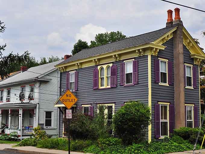 Purple shutters and yellow trim make this Victorian house the definition of "painted lady" architecture done perfectly.