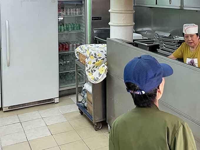 The anticipation is real when you're this close to dumpling nirvana and your order number's almost up.