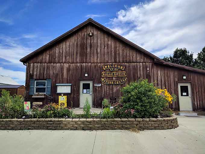 The weathered Nature Center barn welcomes visitors with rustic charm that speaks to generations of prairie heritage and conservation.