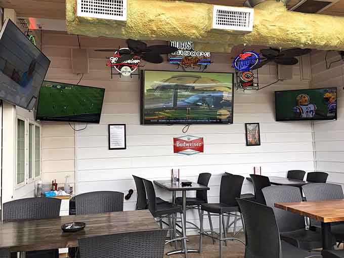 The patio features sports memorabilia and plenty of screens, turning outdoor dining into an all-day event.