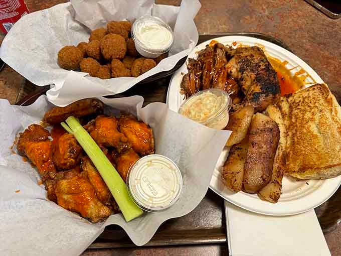 This platter showcases the full barbecue experience: wings, ribs, and sides that all deserve standing ovations together.