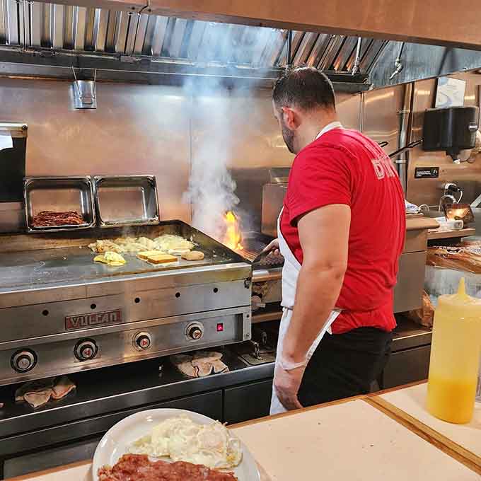 Watch the magic happen on that flat-top griddle where burgers get their legendary caramelized crust.