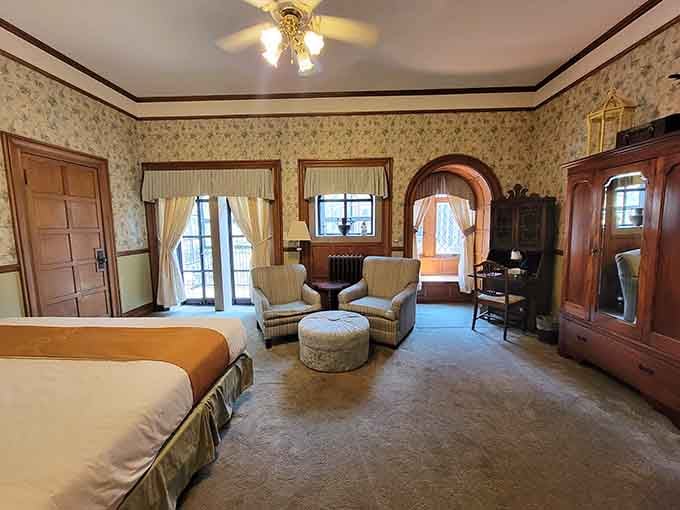 Twin beds in a vintage-styled room offer comfort and charm, proving castles can be cozy too.