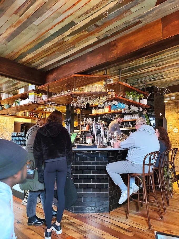 The bar seating offers front-row views of the culinary magic happening behind that handsome subway tile counter.