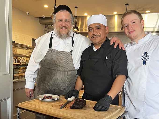 The talented team behind your upcoming food coma, smiling because they know what's about to happen.