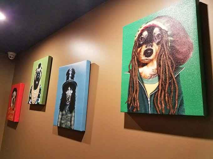 Whimsical dog portraits in various costumes line the walls, adding personality and charm that perfectly matches the restaurant's playful spirit.