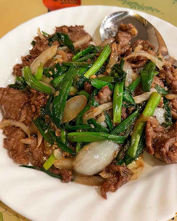Tender beef with scallions, proving that sometimes the simplest combinations create the most satisfying flavors on earth.