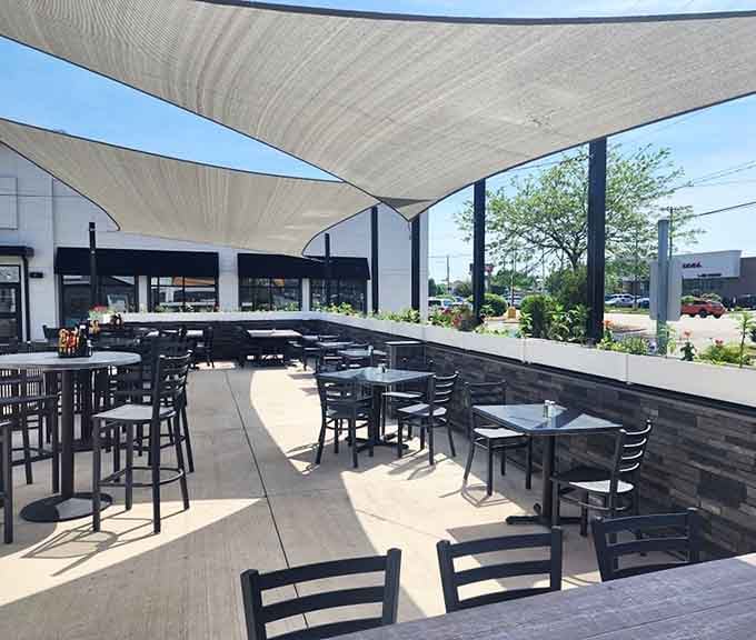 The spacious outdoor patio under shade sails is perfect for Michigan's all-too-brief warm weather months.