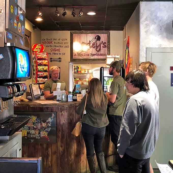 The counter where dreams are ordered and hot dog magic begins, with customers eagerly awaiting their creations.