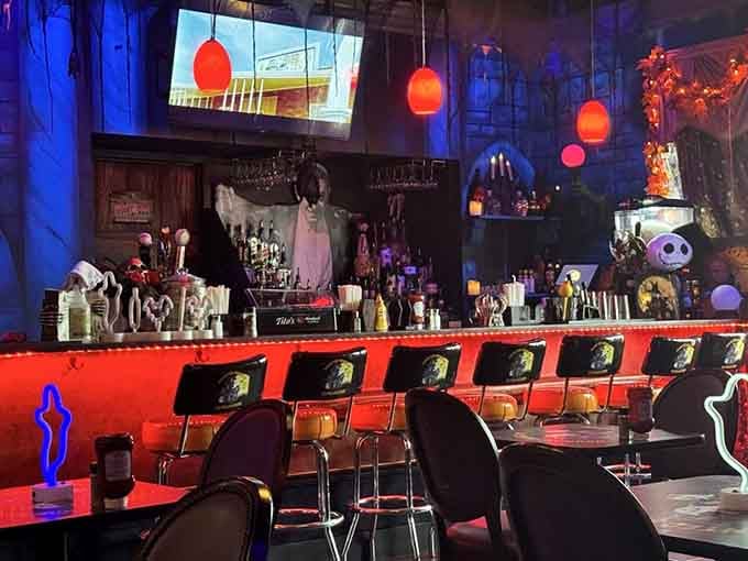 The bar area glows red and blue like a nightclub designed by someone obsessed with October thirty-first.